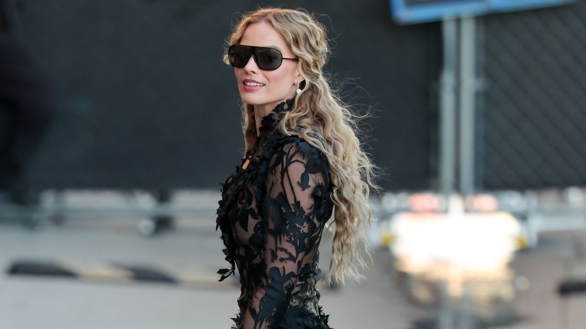 Margot Robbie Wows in Feathered Minidress at Press Tour - theFashionSpot
